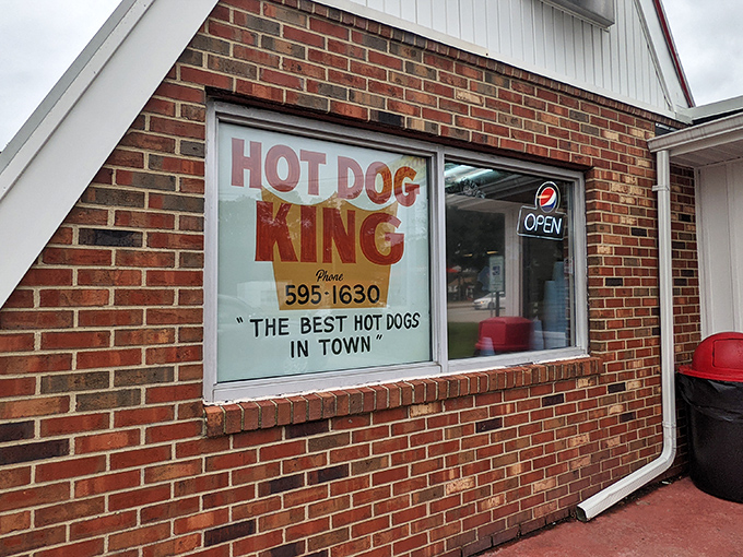 "THE BEST HOT DOGS IN TOWN" isn't bragging if it's true. This brick façade has sheltered more food dreams than most five-star establishments.