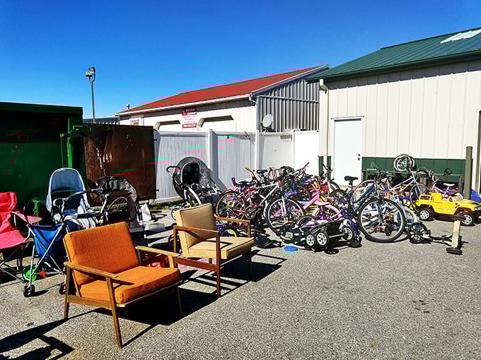 The outdoor overflow area—where patio furniture, bicycles, and outdoor gear wait patiently in the sunshine for their next chapter to begin.
