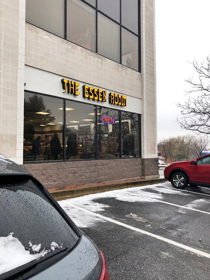 Even on snowy days, The Essen Room's yellow sign glows with promise—a beacon of warmth for those seeking comfort in carb-laden, meaty salvation.