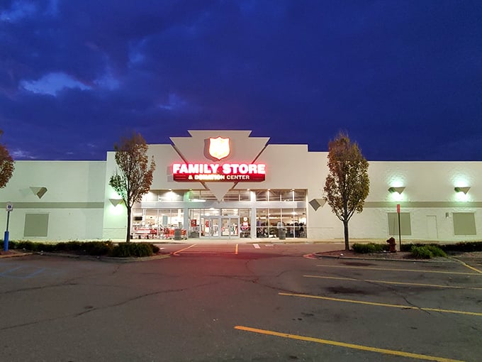 Even at night, the thrift store stands ready for tomorrow's treasure seekers. The parking lot empties as shoppers head home with trunks full of finds.