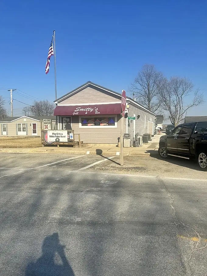 Under clear Illinois skies, Smitty's stands proudly with its American flag—a small building housing enormous flavors and even bigger heart.