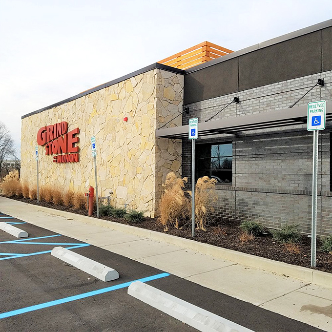 Even the exterior side view has curb appeal – stone walls and ornamental grasses setting the stage for the culinary performance waiting inside.