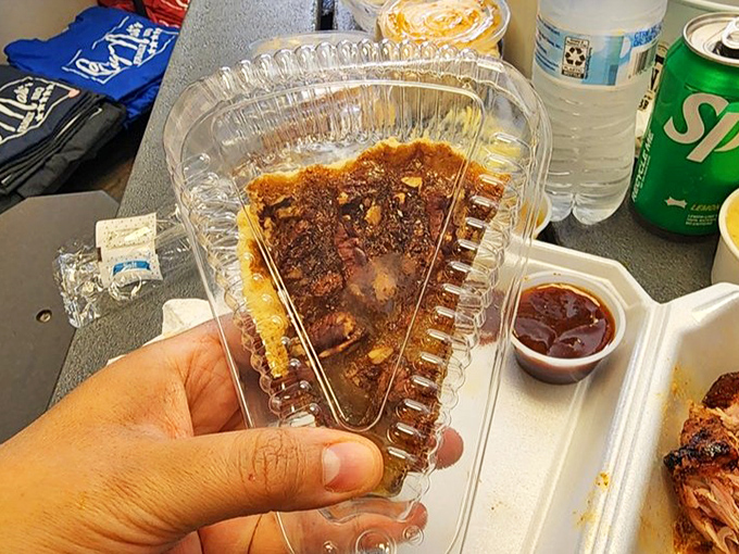Pecan pie in its clear container – the sweet finale to a savory symphony. That glistening filling is nature's candy after a barbecue feast.