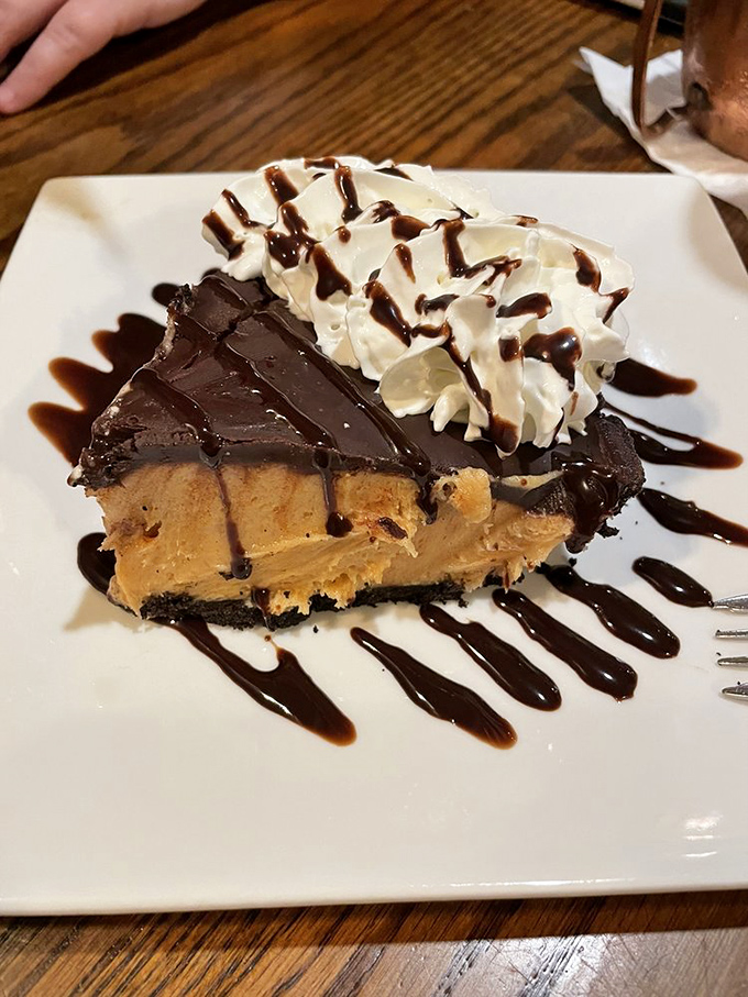 This towering slice of pie serves as the grand finale to an already unforgettable dining experience.