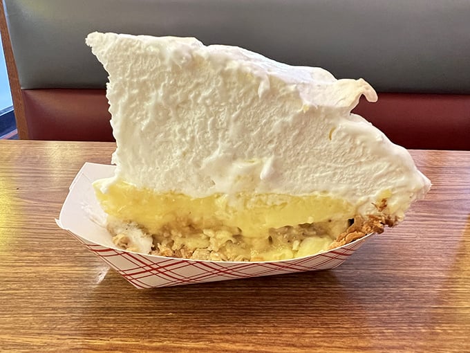 Cream pie that your grandma would approve of—cloud-like meringue towering over custard filling, a slice of Americana that needs no reinvention.