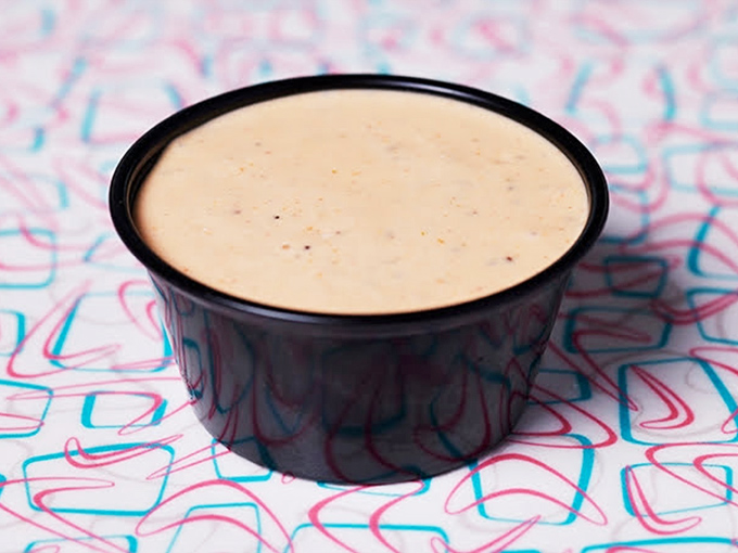 The secret's in the sauce—a silky, mysterious concoction that elevates everything it touches from good to "where has this been all my life?"