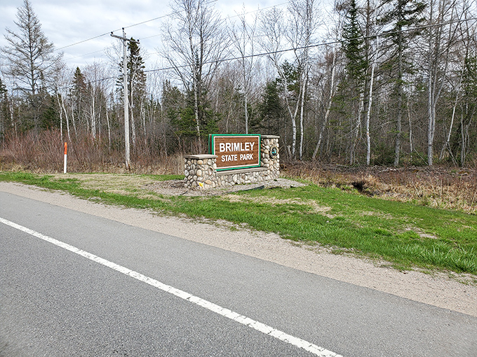 The unassuming entrance sign to Brimley State Park—gateway to experiences that make visitors wonder why they ever vacation anywhere else.