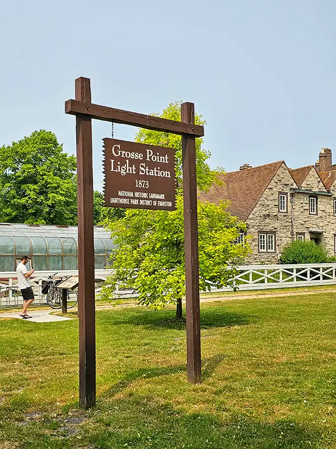 The official entrance sign announces you've arrived at a genuine National Historic Landmark—not just any lighthouse, but Great Lakes royalty since 1873.