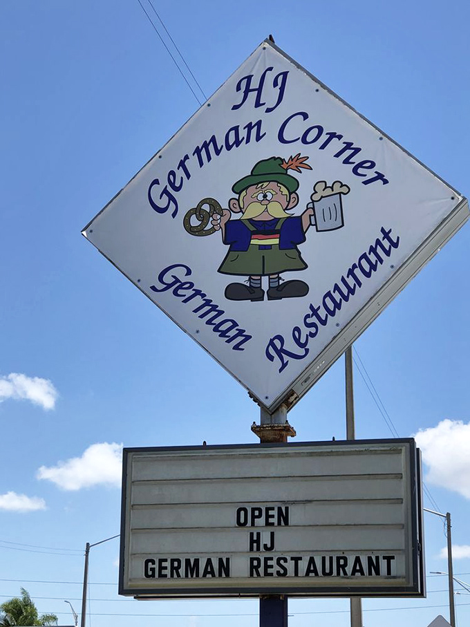 The cheerful mascot on HJ German Corner's sign has been welcoming hungry visitors for years—a friendly face promising pretzels, schnitzel, and gemütlichkeit inside.