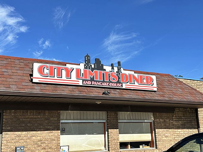 The iconic sign beckons hungry travelers like a lighthouse guiding ships to safe harbor. Follow it to breakfast bliss.