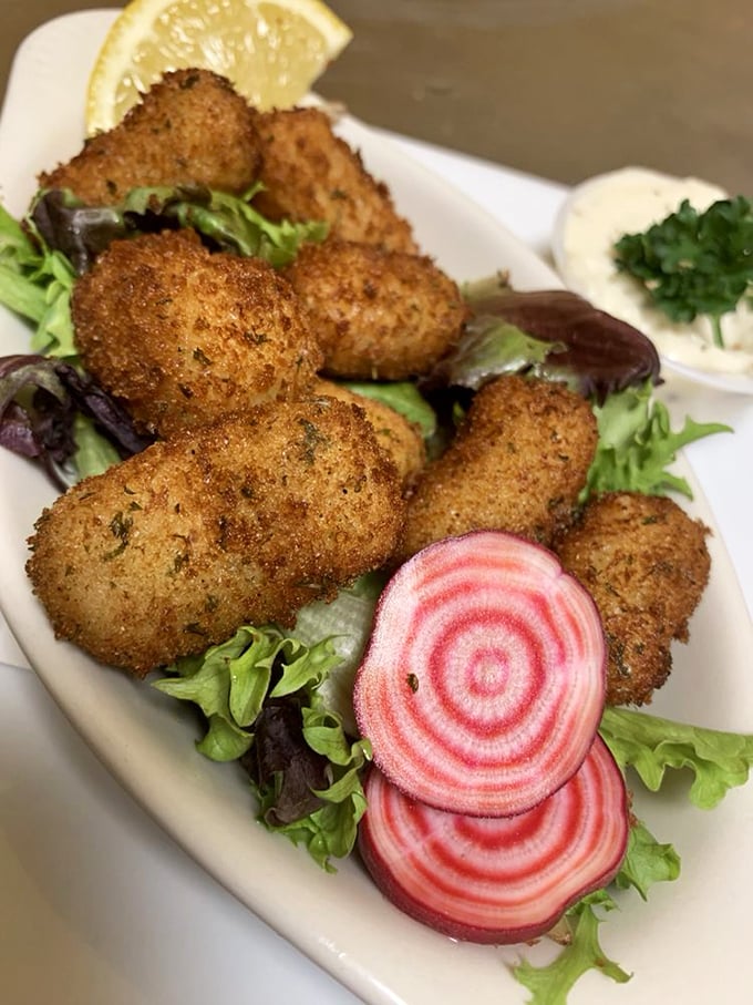 Crispy haddock croquettes nestled among colorful beets – British comfort food that's both photogenic and utterly craveable.