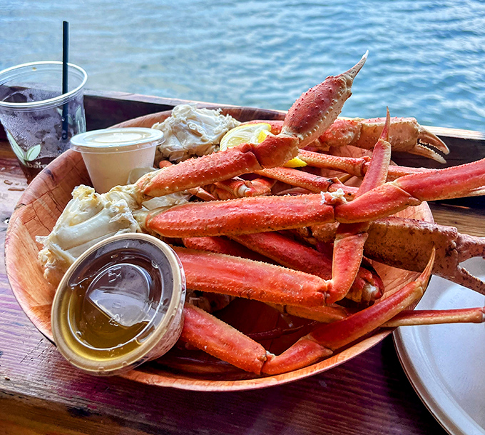 Snow crab legs positioned like edible architecture, served with drawn butter and the Intracoastal as your backdrop—Florida dining doesn't get more authentic.