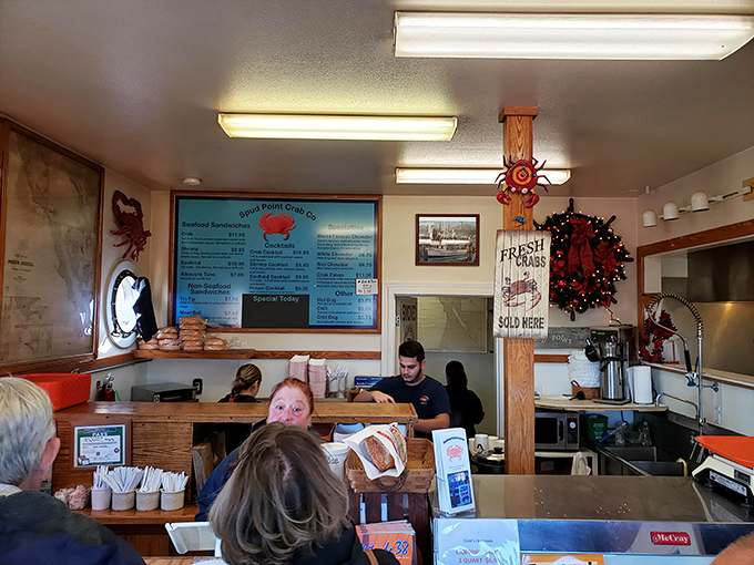 Where seafood dreams come true—staff working behind the counter, ready to deliver oceanic treasures to eager seafood pilgrims.