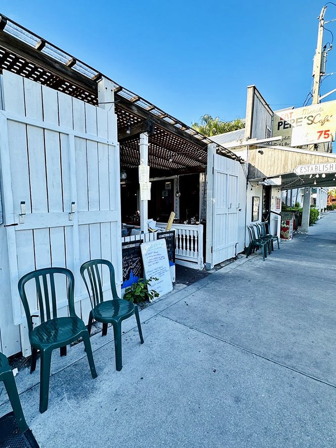 Simple white walls and green chairs outside—no pretense needed when what's inside has been perfected over generations.