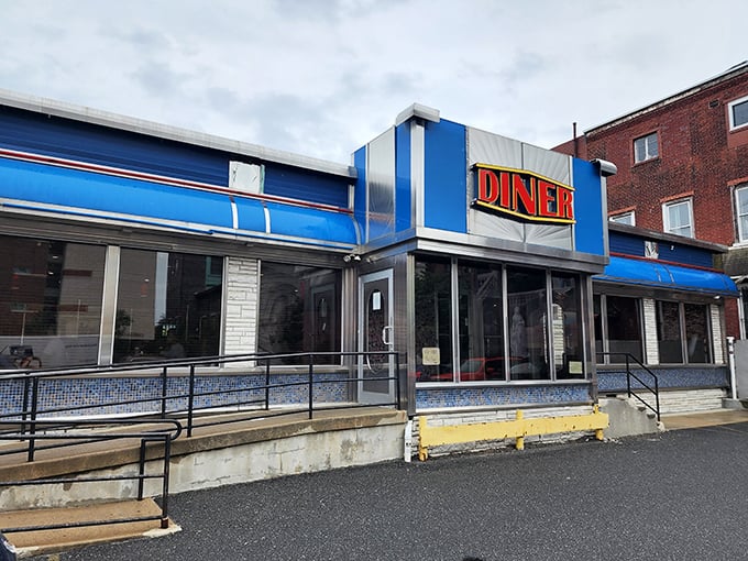 That neon sign doesn't just advertise a diner—it promises a Philadelphia institution where hunger goes to meet its delicious match.