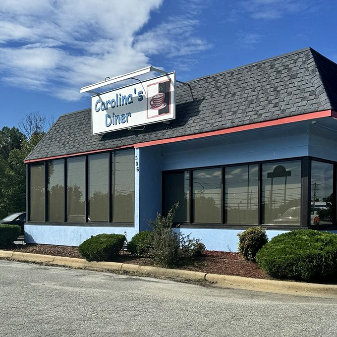 Carolina's Diner doesn't just serve food—it serves memories with a side of nostalgia under that iconic blue and white facade.