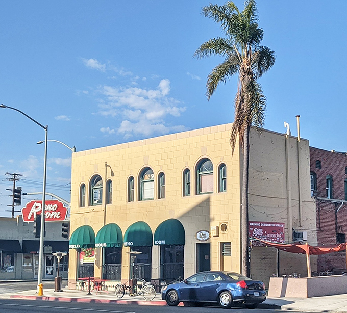 The corner of Redondo and Broadway—where palm trees stand guard over one of Long Beach's most beloved watering holes.