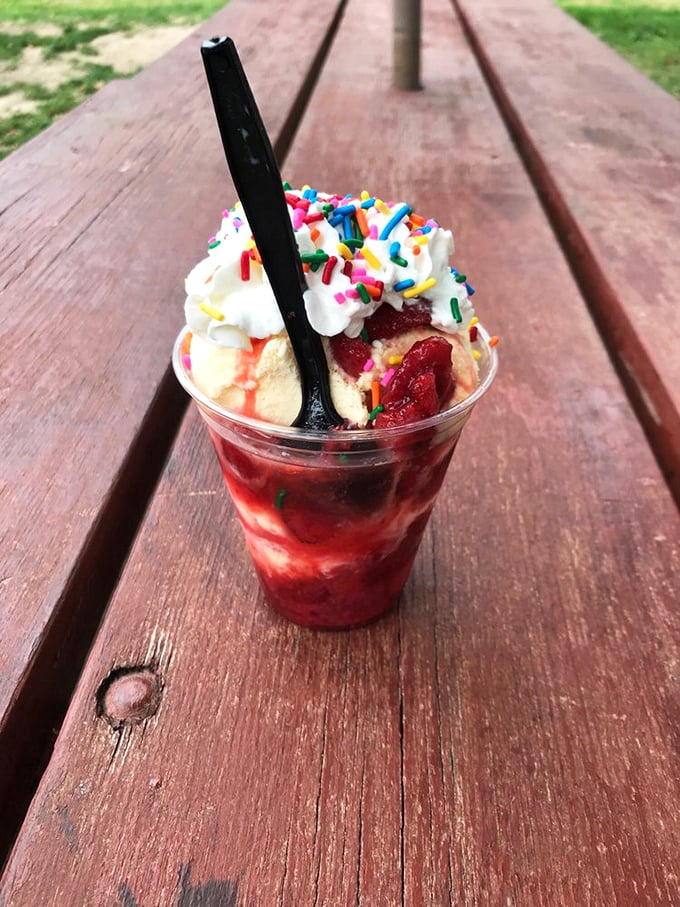 This strawberry sundae isn't just dessert—it's summer captured in a cup, complete with sprinkles that promise to make any day better.