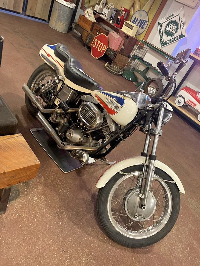 This vintage motorcycle isn't just transportation—it's mechanical sculpture, a chrome-and-steel time machine waiting for someone to bring its engine roaring back to life.