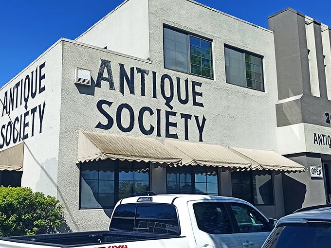 The Antique Society's unassuming exterior hides a wonderland of treasures – like finding Narnia in a strip mall!