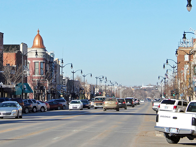 Arkansas City's historic downtown stretches into the distance, where copper-domed buildings stand like sentinels of small-town charm.