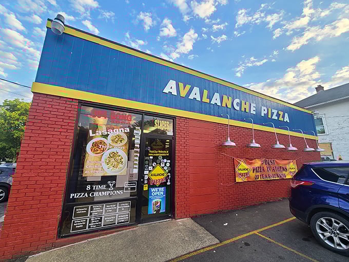 That blue and red brick combo screams "serious pizza lives here" – no fancy frills needed.
