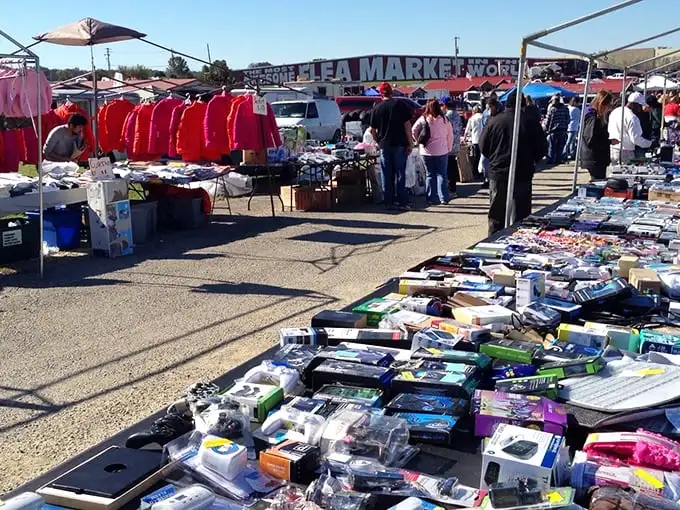 Treasure hunters paradise! The Awesome Flea Market's outdoor section buzzes with colorful tents and tables loaded with potential finds.