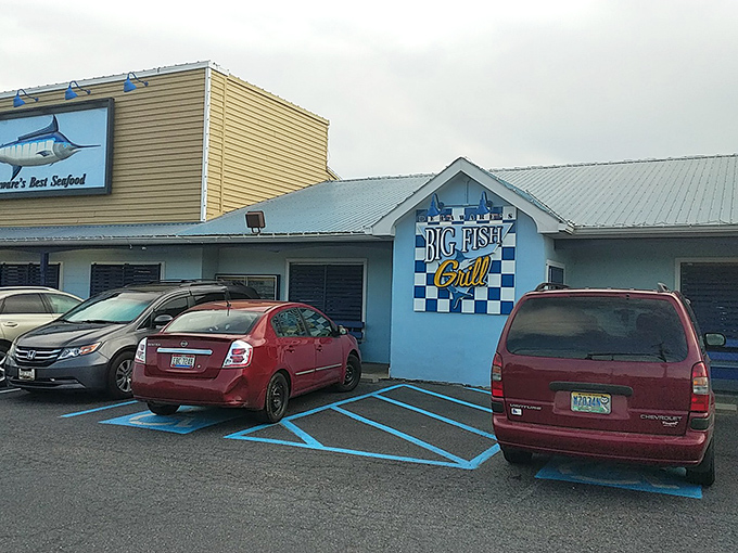 The blue and white checkerboard sign of Big Fish Grill promises seafood bliss – like finding a beach treasure hiding in plain sight!