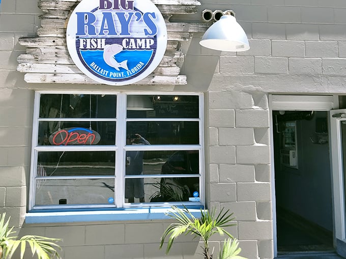 The unassuming entrance to Big Ray's Fish Camp – where seafood legends are born behind that humble white facade.