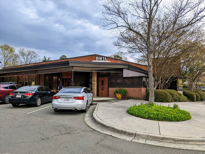 Bin 54's brick exterior might look unassuming, but inside awaits a temple of beef that would make even the most jaded carnivore weep with joy.