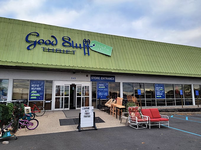 The green-roofed wonderland of Good Stuff Thrift beckons with treasures waiting just beyond those glass doors.