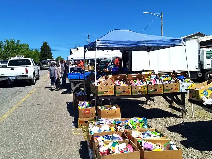 Boxes of treasures await at Jamestown Market! Like a yard sale from heaven, with colorful containers holding everything from spices to toys.