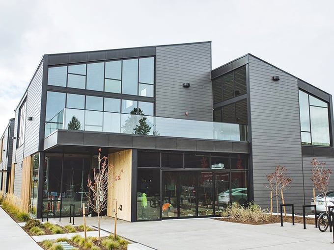 The modern glass facade of Rancher Butcher Chef gleams in daylight, promising a farm-to-table experience that's anything but ordinary.