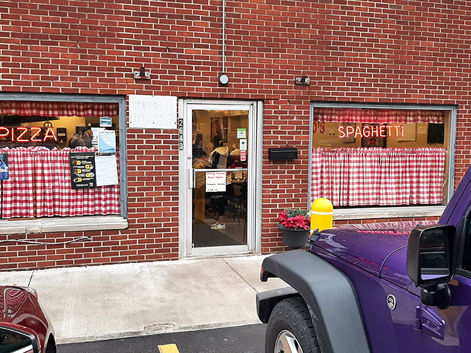 The red checkered curtains at Rubino's aren't just decoration—they're a promise that pizza tradition lives here!