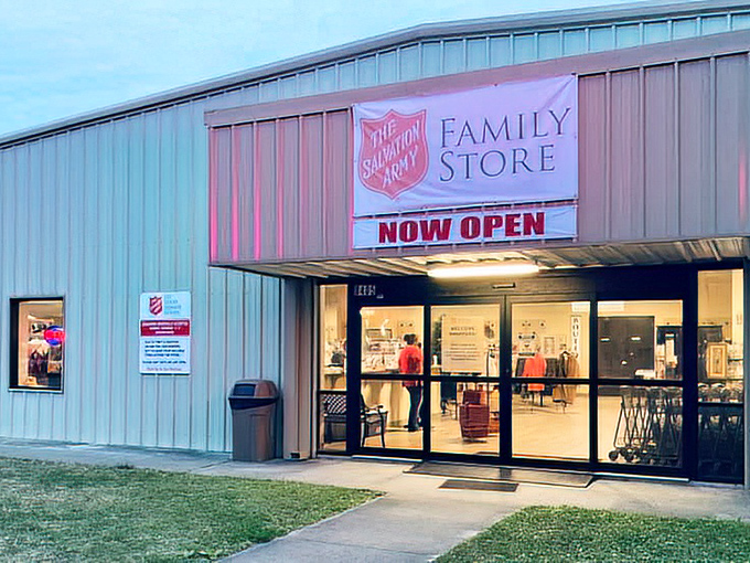 The Salvation Army Family Store welcomes bargain hunters with its bright "NOW OPEN" sign—a treasure cave disguised as a simple metal building.