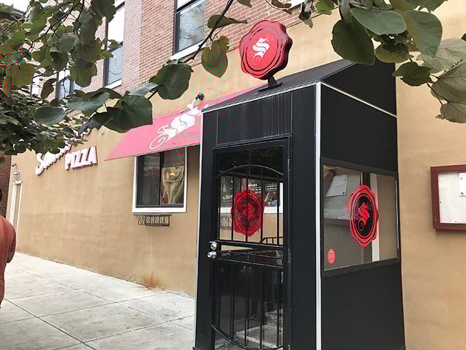 The iconic red "S" of Santucci's beckons pizza lovers like a lighthouse for the hungry. That upside-down pizza magic awaits inside!