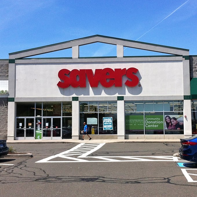 The iconic red Savers sign beckons like a lighthouse to thrift enthusiasts. Treasure hunting starts here!