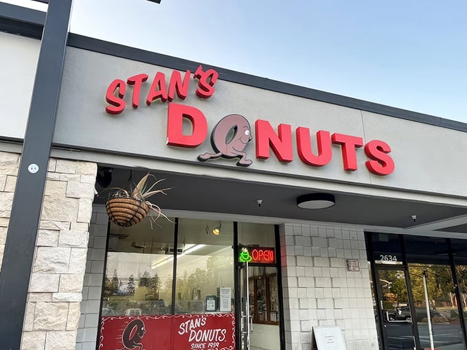 Stan's Donuts storefront beckons with its cheerful red sign – like a beacon of sugary hope in a strip mall sea.