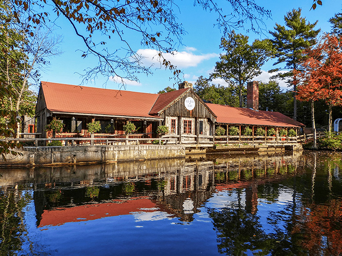 The 1761 Old Mill sits like a postcard come to life, reflecting perfectly in the pond as if nature's showing off.