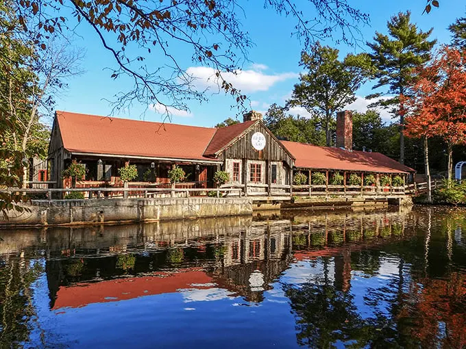 The 1761 Old Mill sits like a postcard come to life, reflecting perfectly in the pond as if nature's showing off.