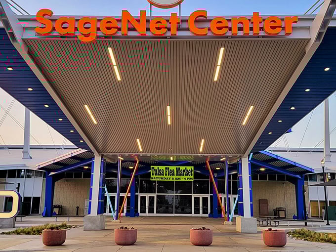 The SageNet Center welcomes treasure hunters with its modern design. Tulsa Flea Market's colorful entrance promises adventure inside!