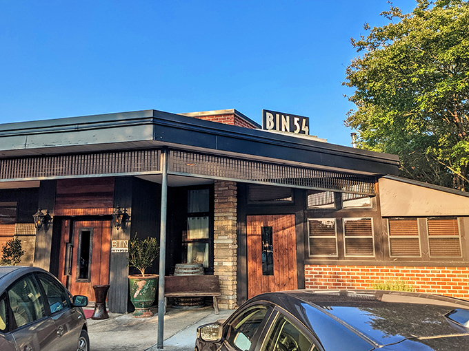 The understated elegance of Bin 54 by day transforms into a beacon for steak lovers by night—like Clark Kent turning into Superman, but for dinner.