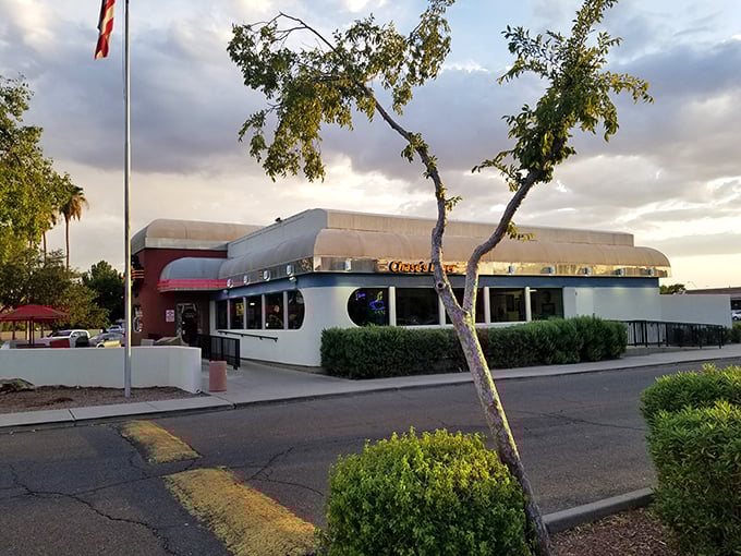 The classic curved roof and gleaming exterior of Chase's Diner stands guard against modern dining trends like a sentinel of syrup and nostalgia.