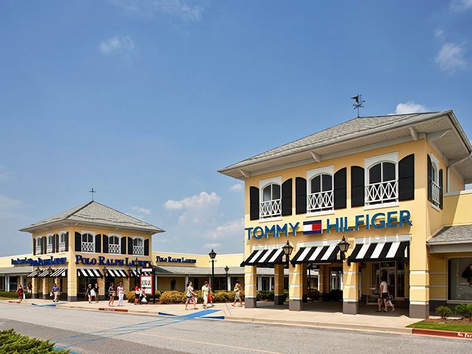 Tommy Hilfiger and Polo Ralph Lauren stand like fashion sentinels, guarding gateways to bargain paradise at Gaffney Premium Marketplace.