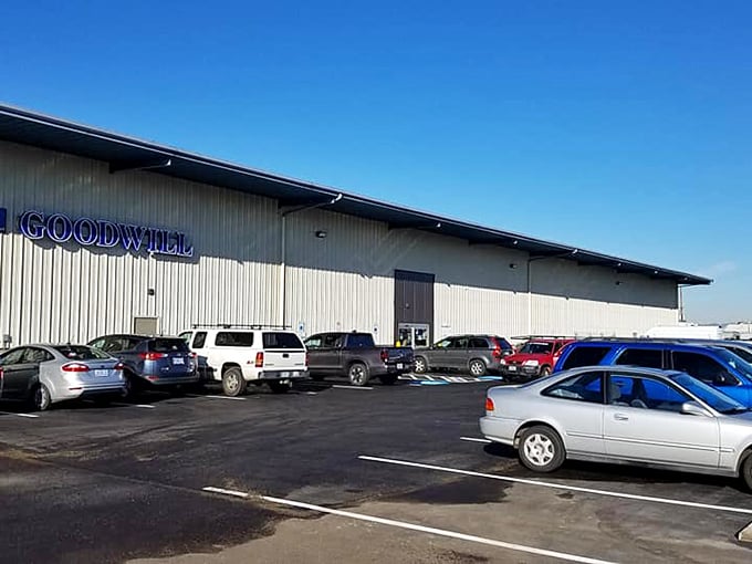 A thrifter's paradise awaits! This massive Goodwill outlet's parking lot hints at the vast bargain universe inside.