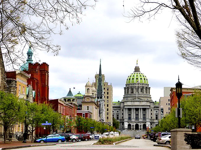The majestic Pennsylvania State Capitol stands proud at the end of State Street. That green dome against a blue sky? Postcard perfection.