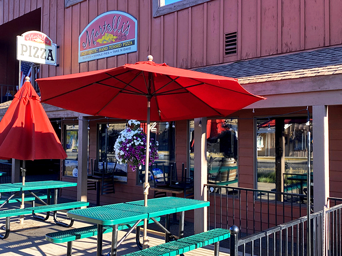 Those bright red umbrellas aren't just for show – they're sheltering pizza worth writing home about.