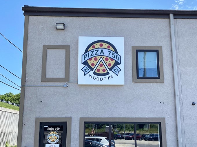 That bold "WOODFIRE" sign isn't just decoration—it's a promise of pizza magic happening inside those brick ovens.