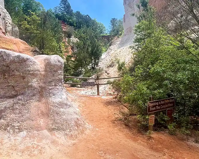 The "Little Grand Canyon" trail winds between towering walls of red clay – Mother Nature's art gallery without the admission fee.
