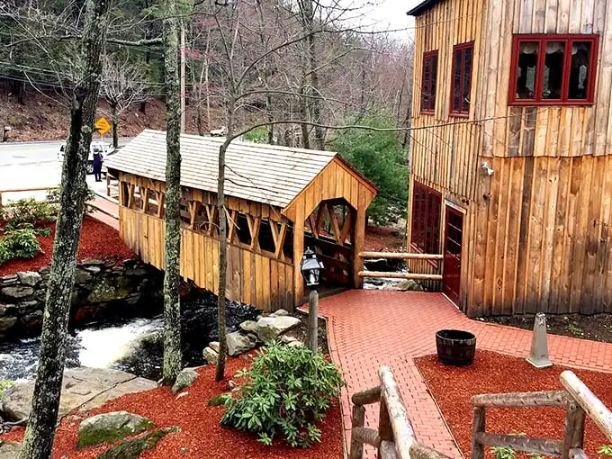 That covered bridge isn't just for show—it's your gateway to steak paradise in a setting straight from a New England dream.